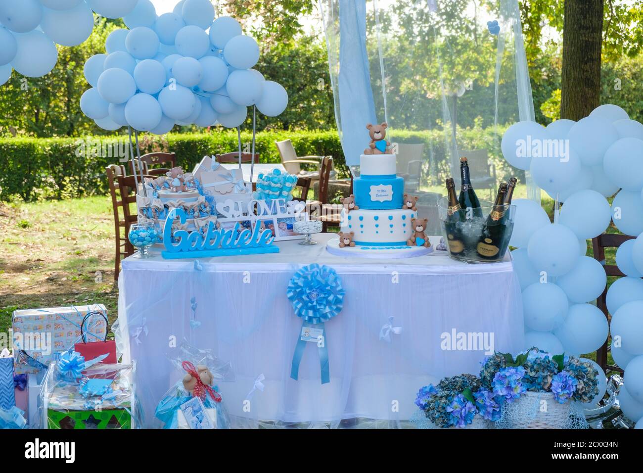 set up for baby baptism with puppets and blue balloons. High quality ...