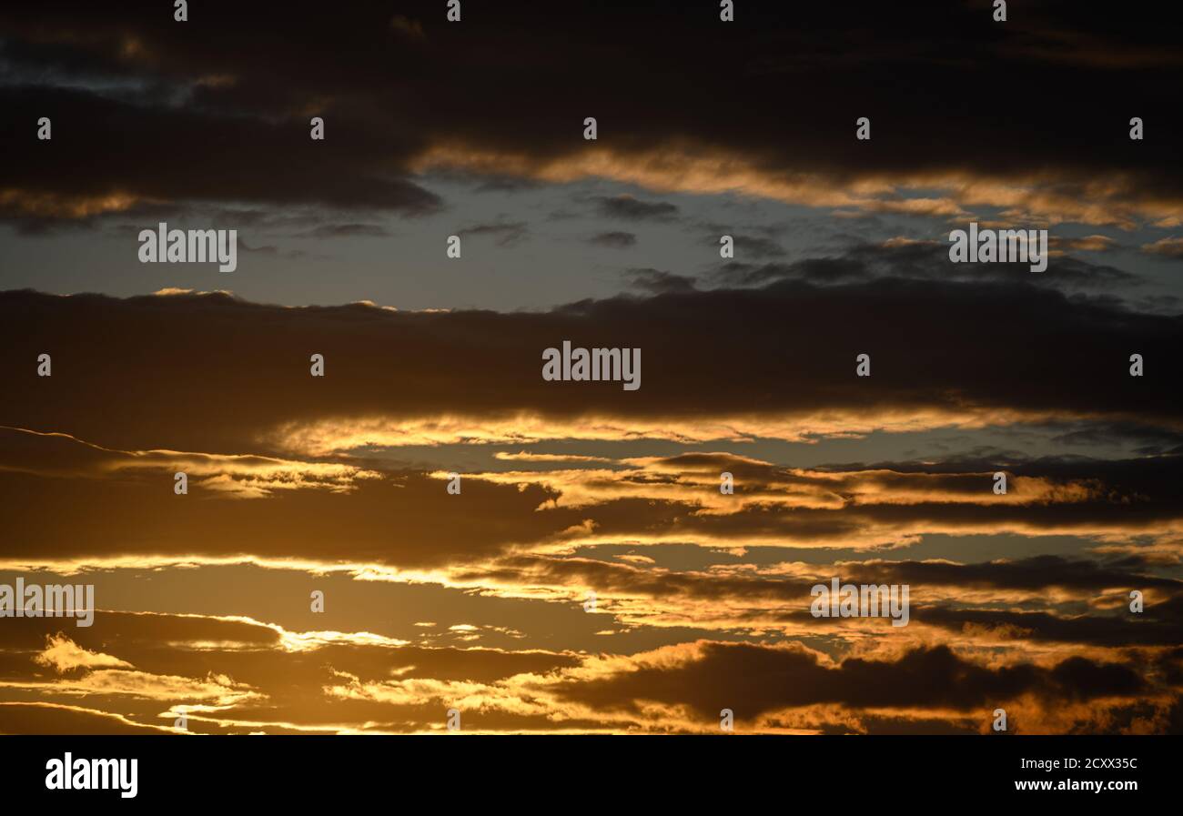 Beautiful and warm colored sunset sky Stock Photo - Alamy