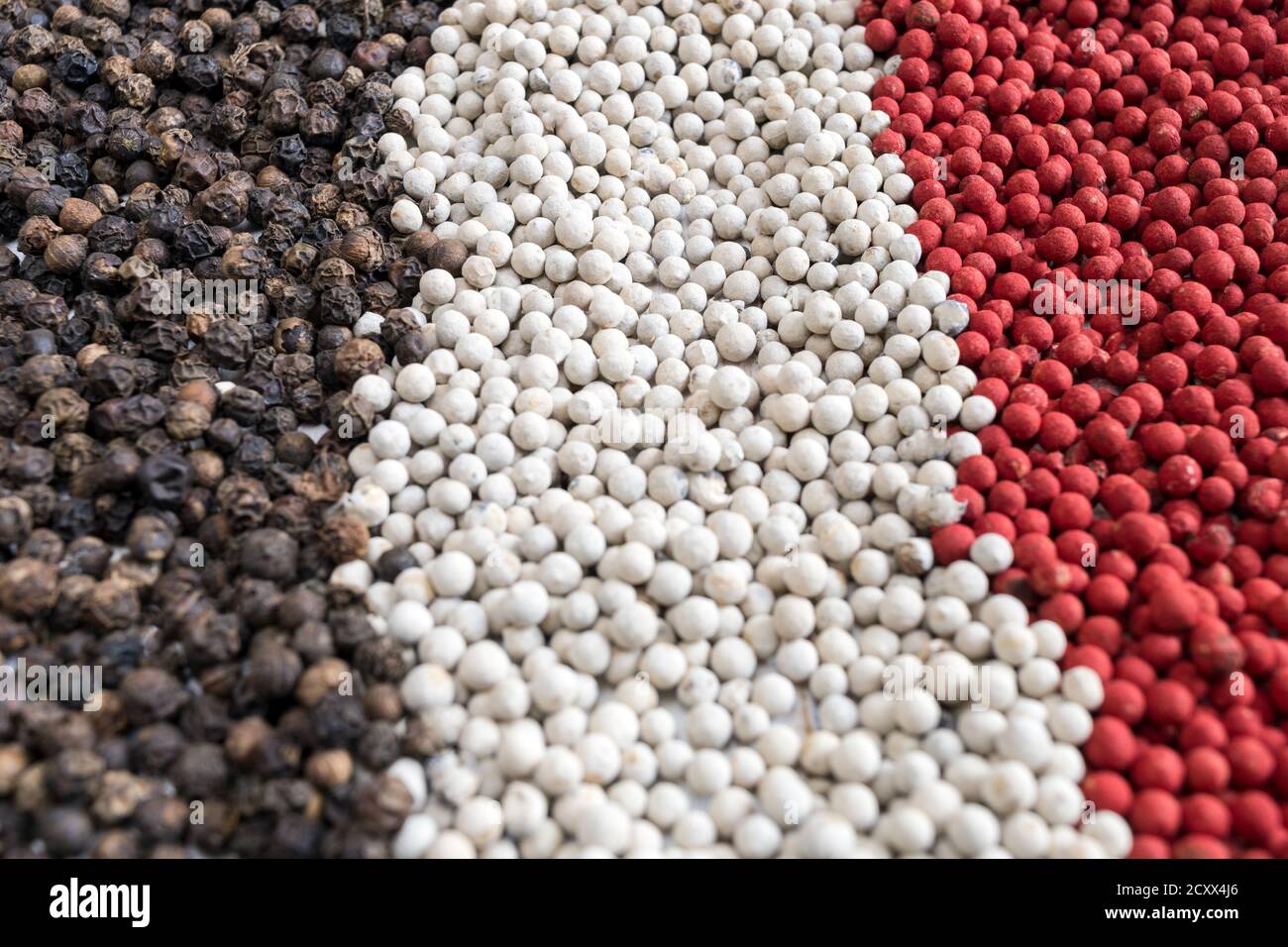 three peppercorns background. black, white and red peppercorns Stock ...
