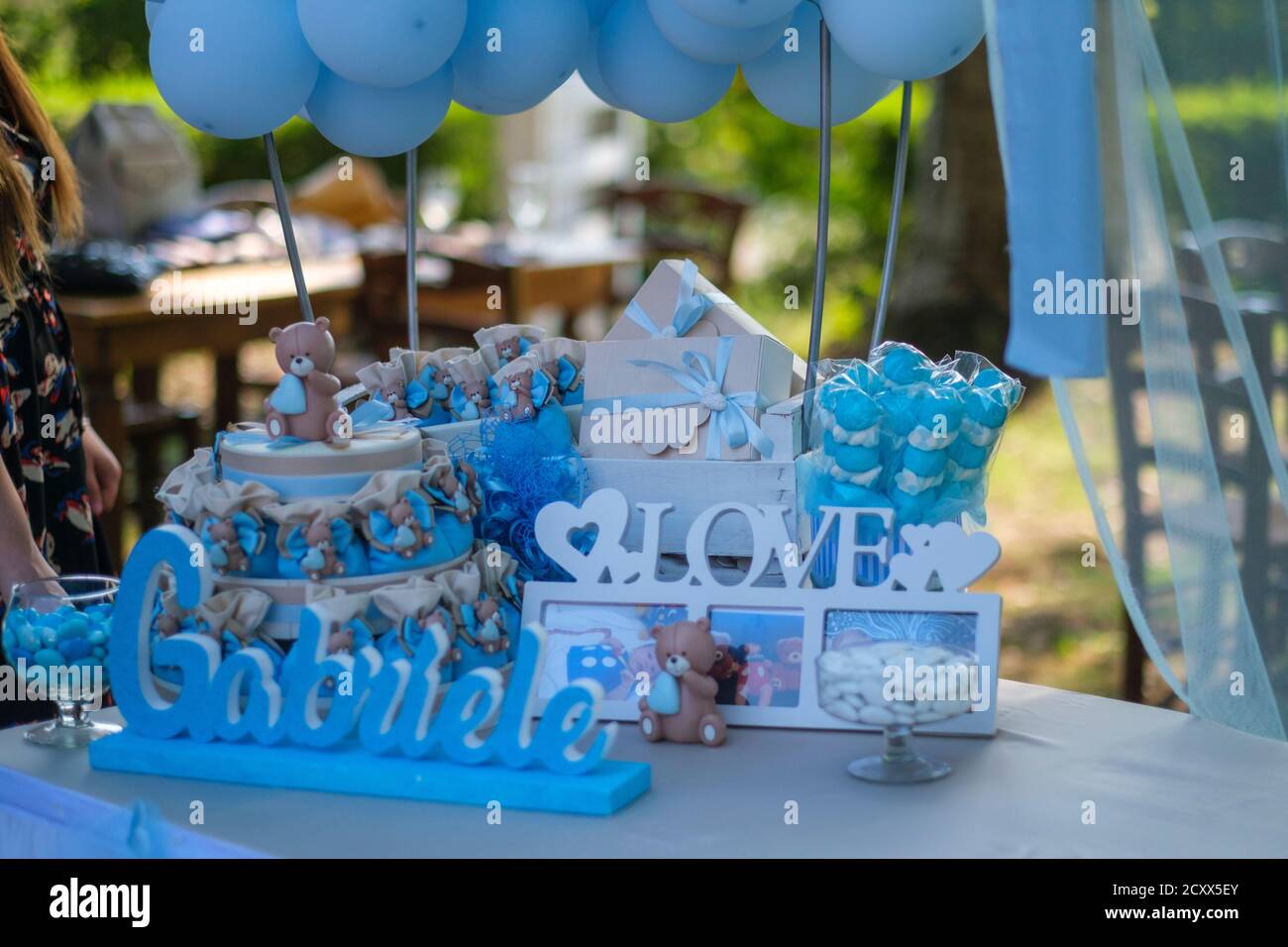 set up for baby baptism with puppets and blue balloons. High quality ...