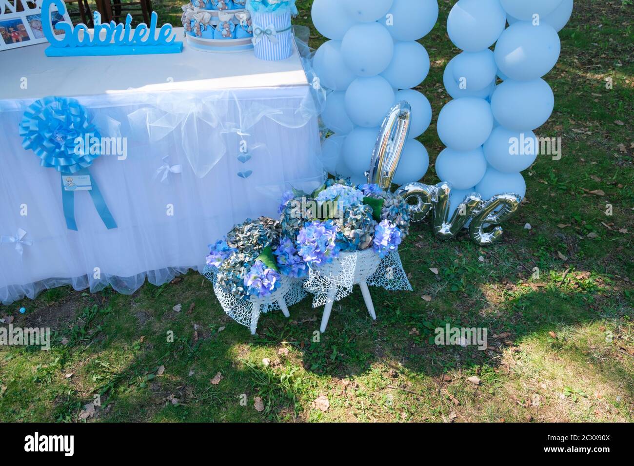 set up for baby baptism with puppets and blue balloons. High quality ...