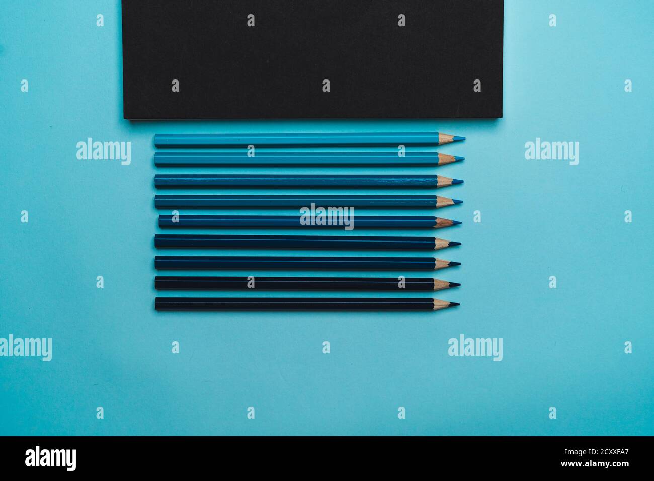 Stationery - book, pencil, ruler on a blue background Stock Photo - Alamy