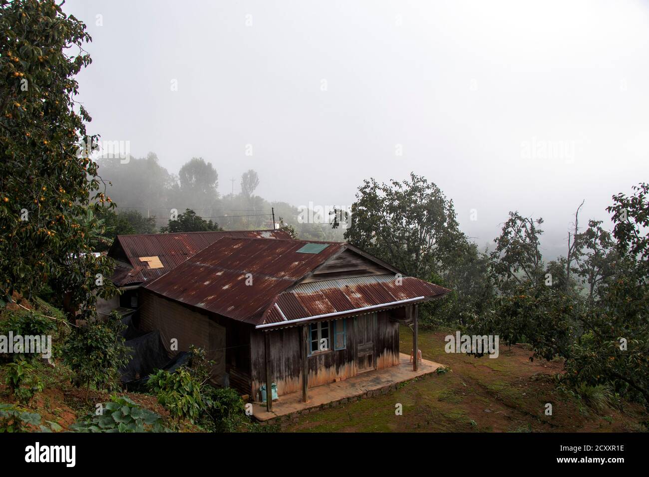 peaceful house at the foot of the hill Stock Photo - Alamy
