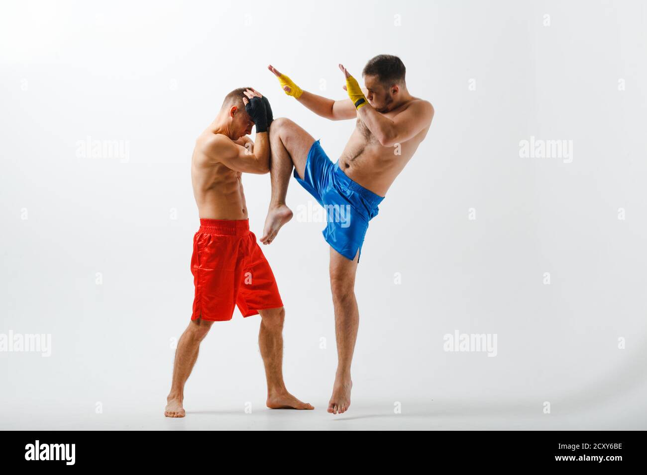 Two men boxers fighting muay thai kickboxing white background Stock ...