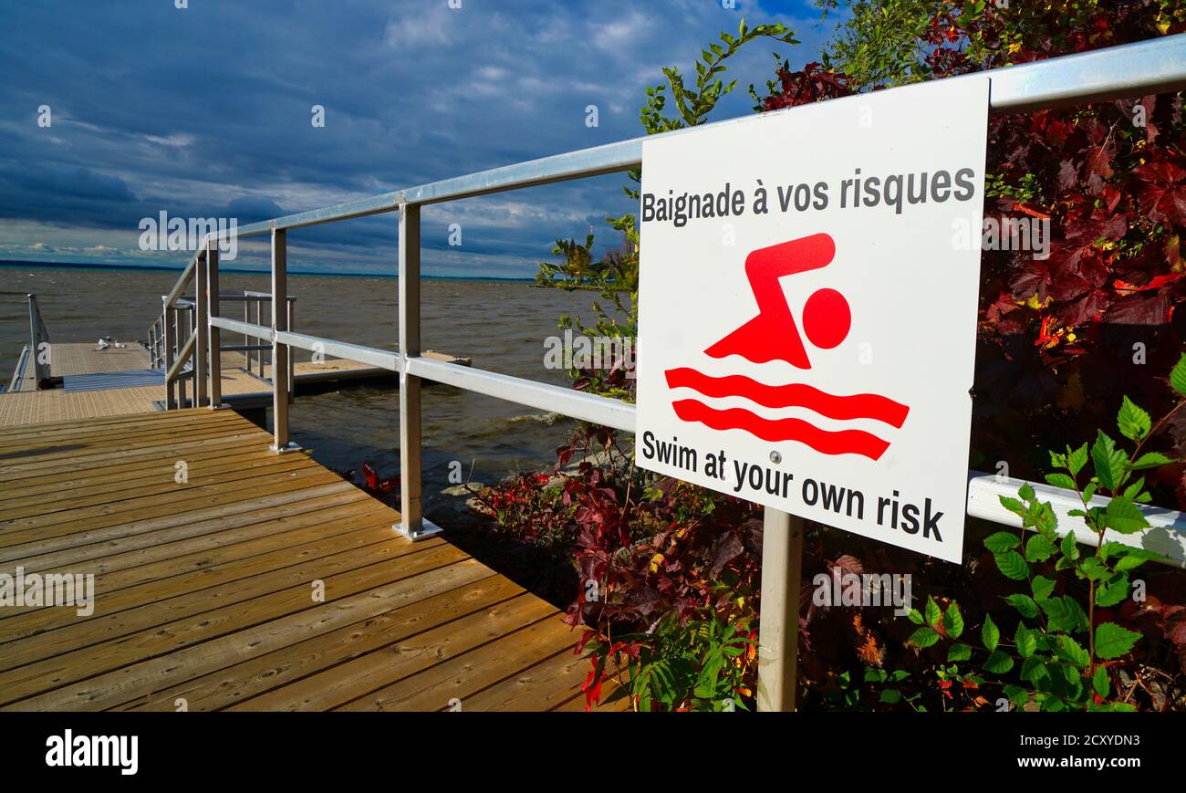 Swim at your own risk sign hi-res stock photography and images - Alamy