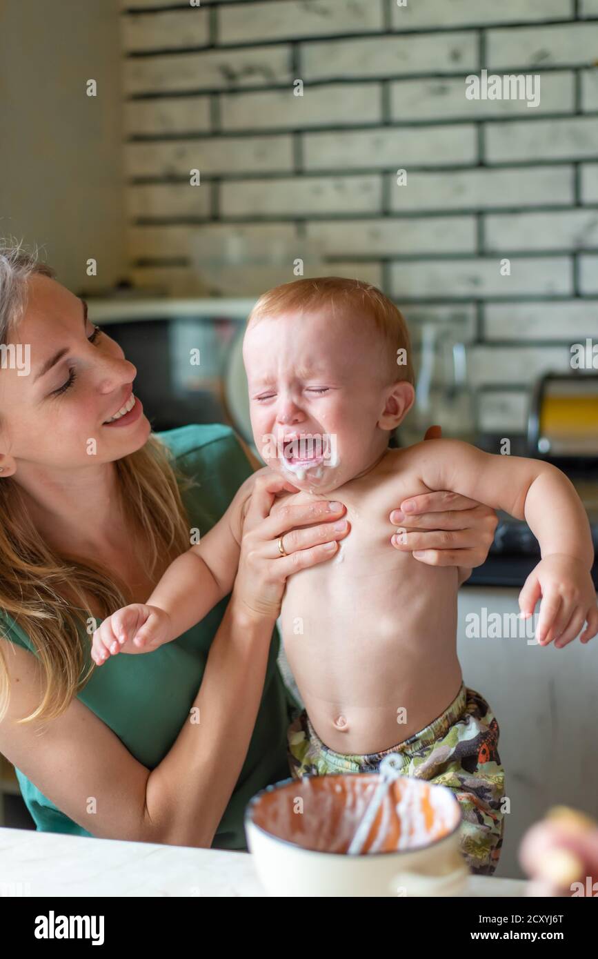 The child cries and refuses to eat milk porridge Stock Photo - Alamy