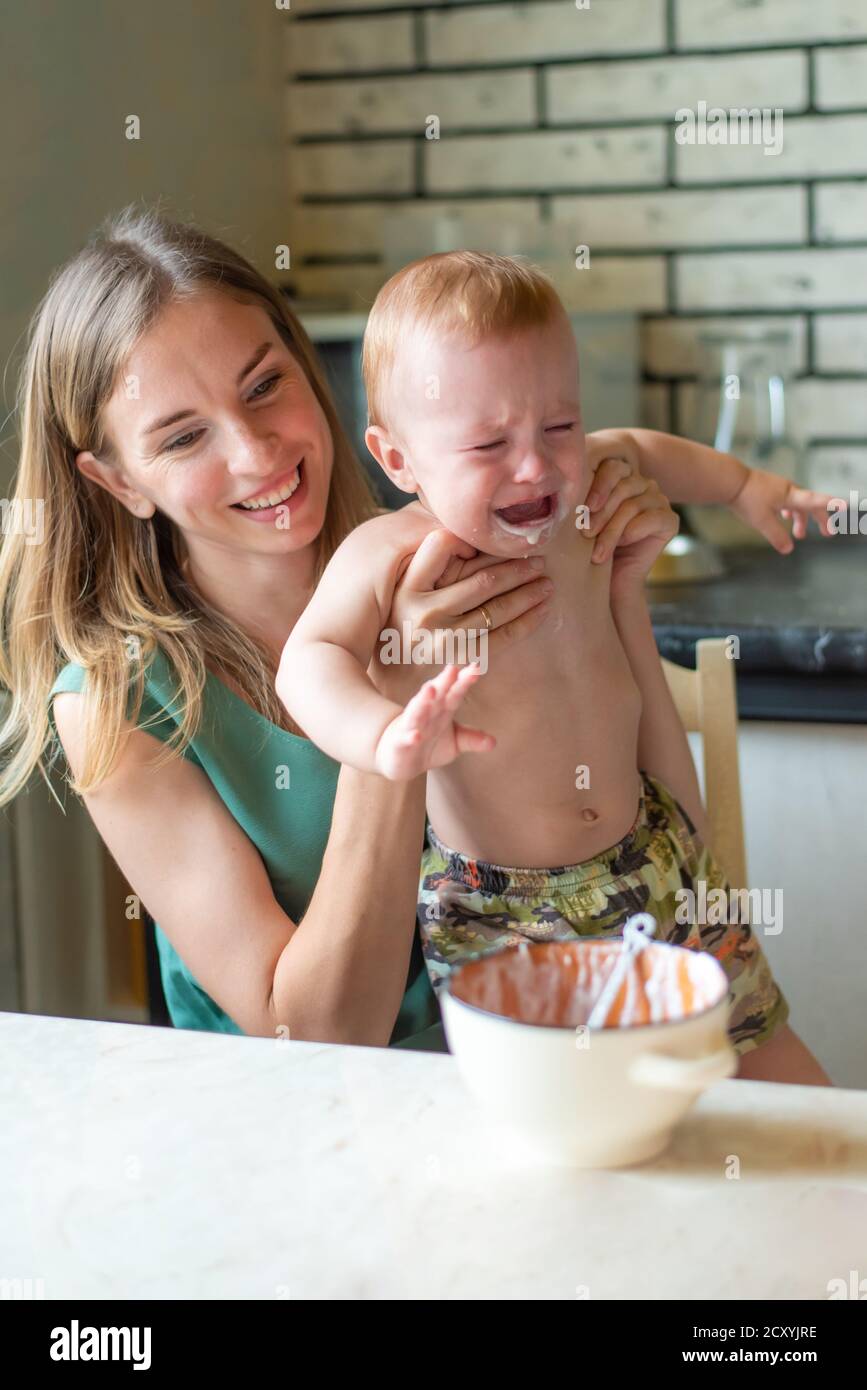 The child cries and refuses to eat milk porridge Stock Photo - Alamy