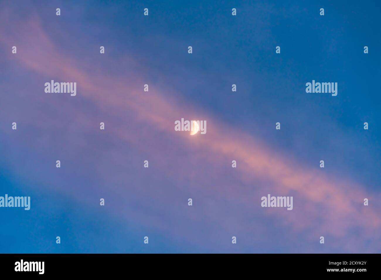 Half moon appears over the Manhattan at New York City Stock Photo - Alamy