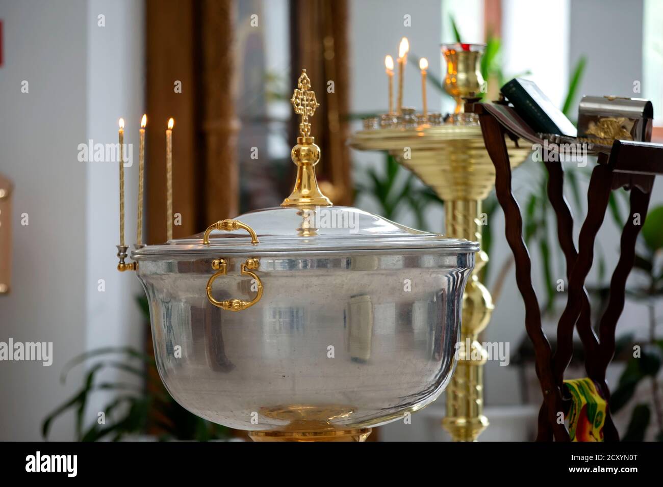 The interior of the church during the baptism of a child. Bath for ...
