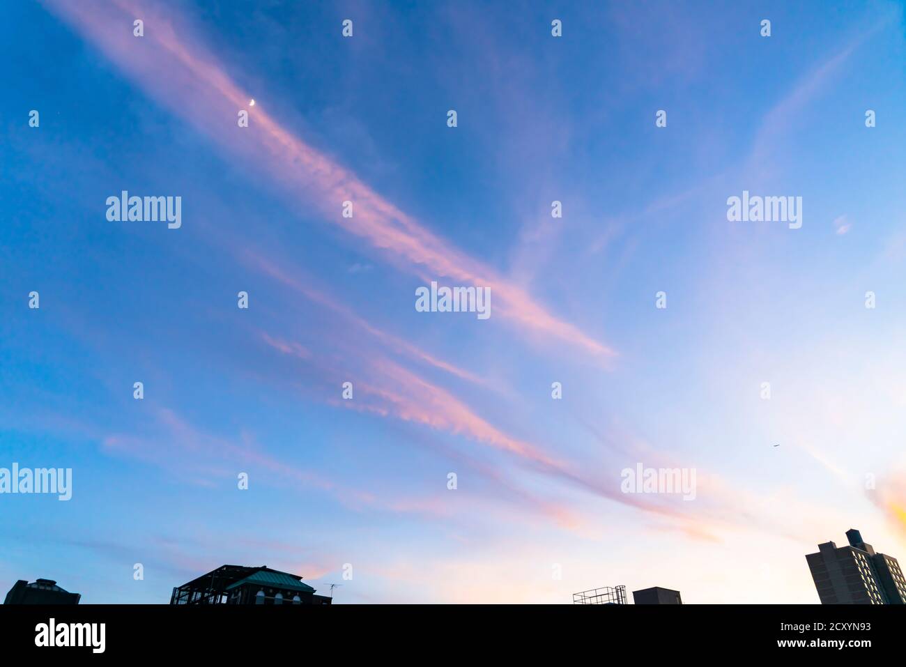 Half moon appears over the Manhattan at New York City Stock Photo - Alamy