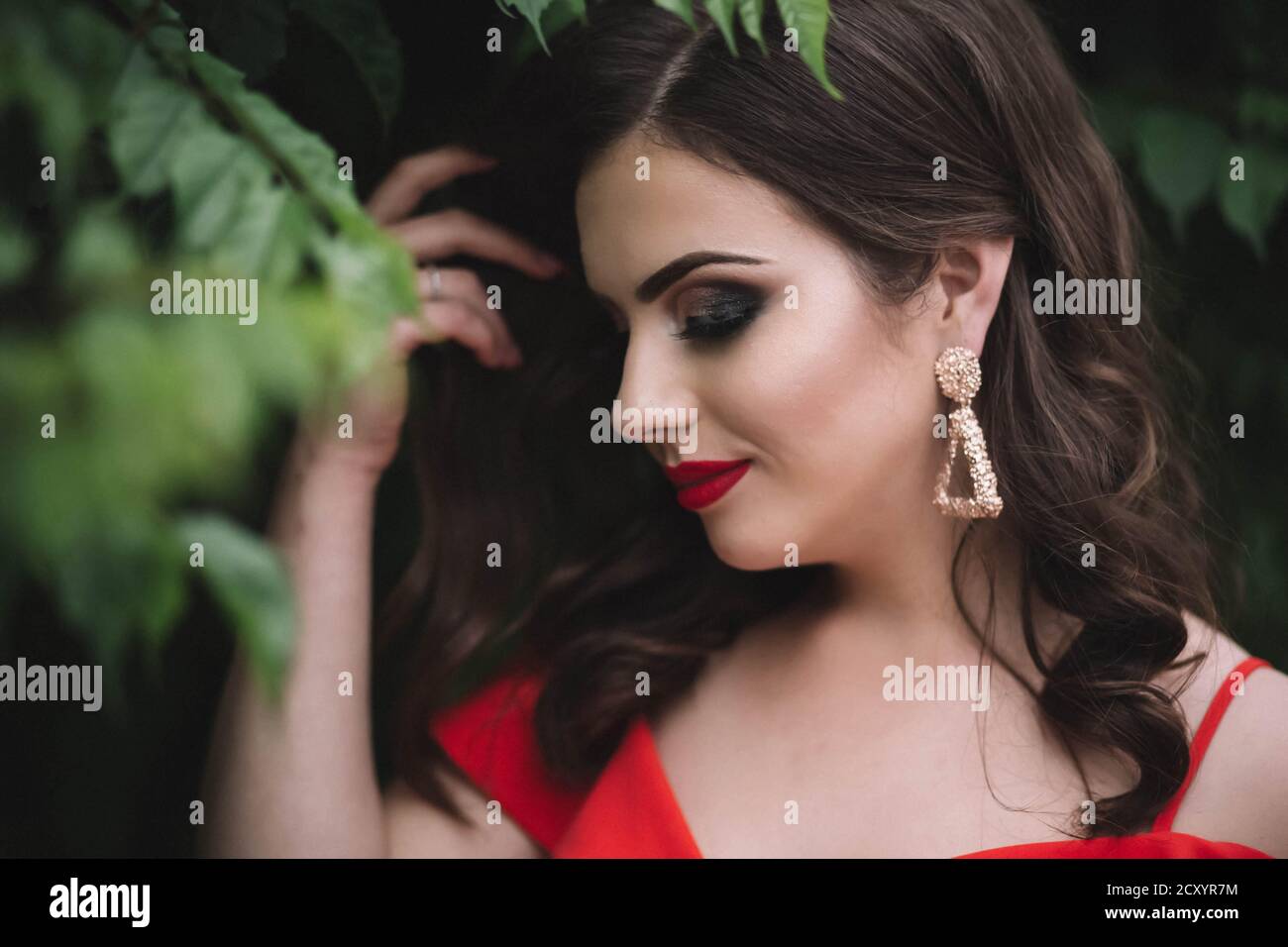 Beautiful young teen girl ready for prom. Head shot, bijoux earrings ...