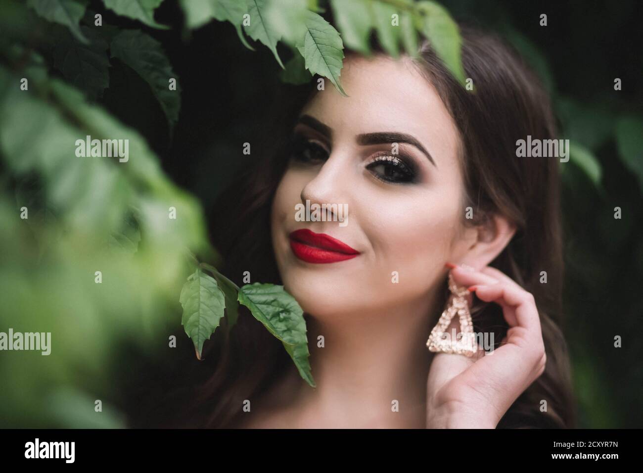 Beautiful young teen girl ready for prom. Head shot, bijoux earrings ...