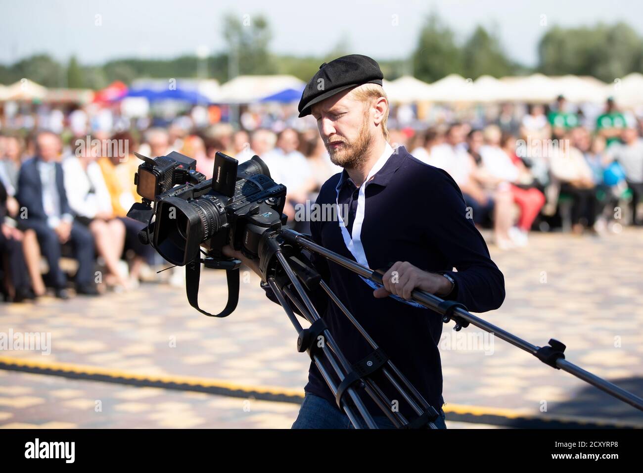 August 29, 2020 Belarus, Gomil. City holiday. Videographer with a video ...