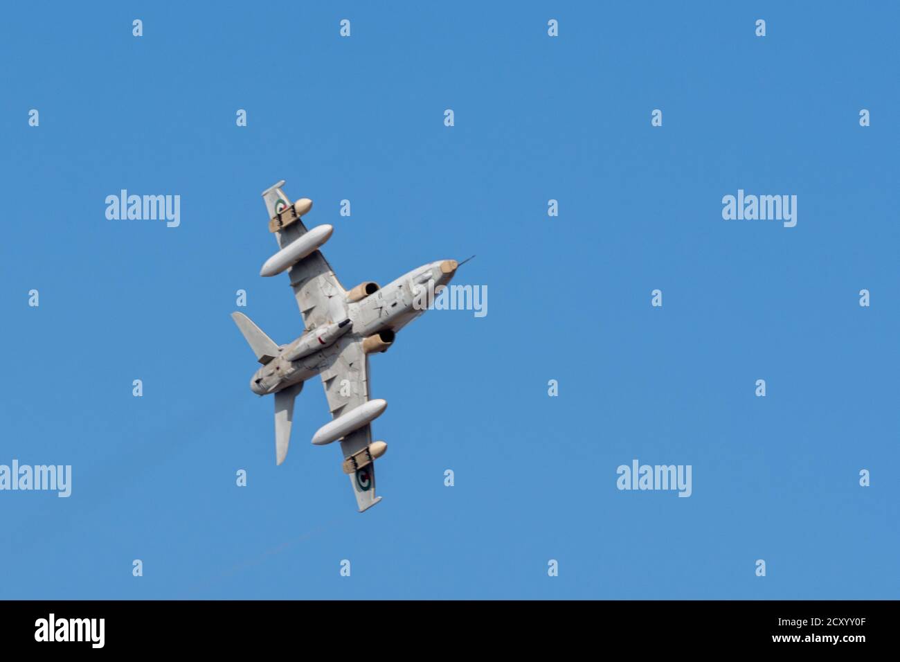 Military fighter jet flying fast through the air in coordination with ...