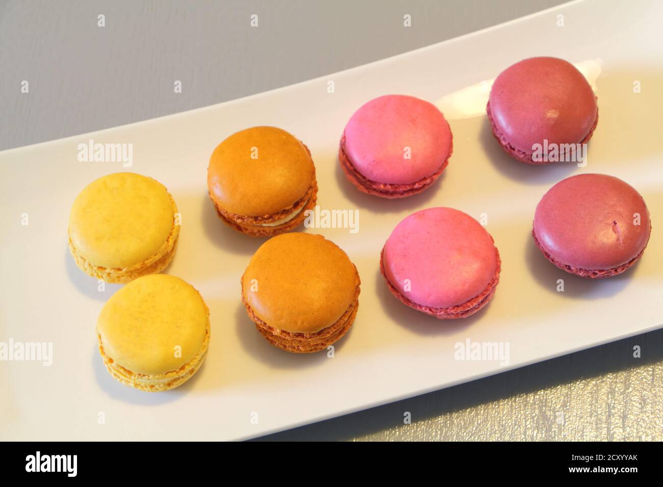 Fruit flavoured macaroons on a white dish Stock Photo - Alamy