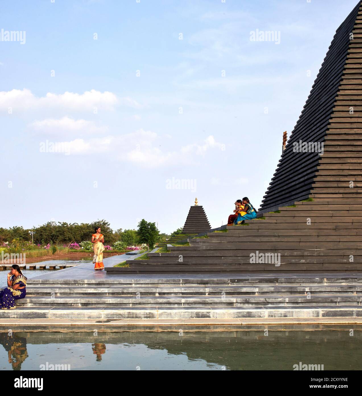 Overall View with local villagers sitting on steps. Balaji Temple ...