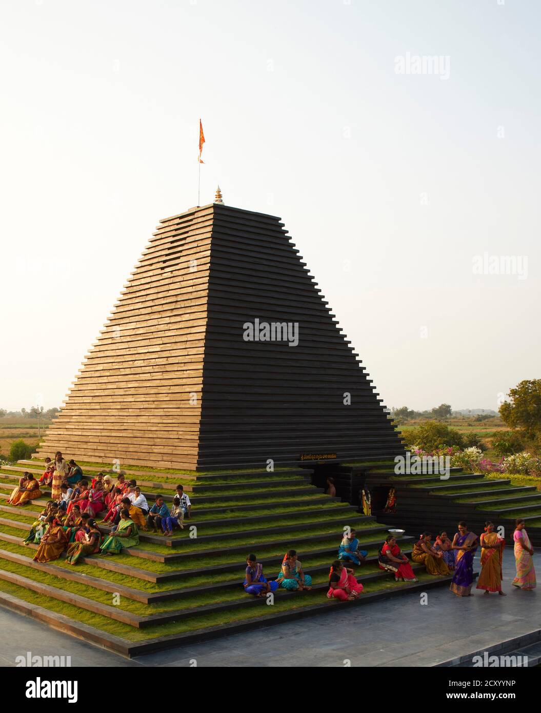 Overall View with local villagers sitting on steps. Balaji Temple ...