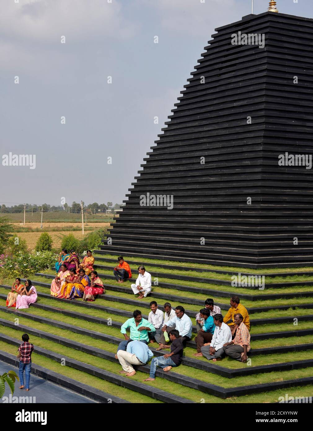 Overall View with local villagers sitting on steps. Balaji Temple ...