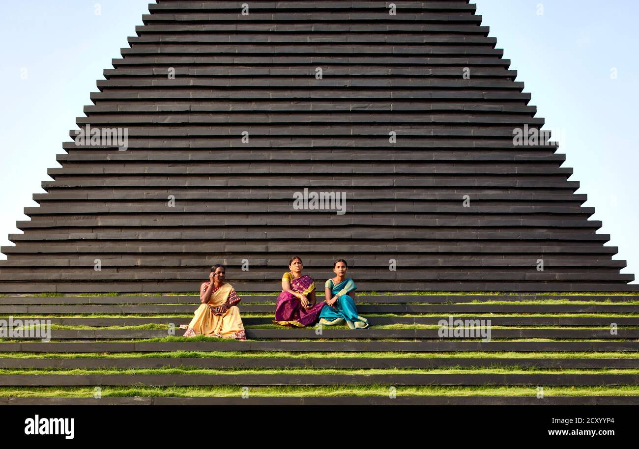Overall View with local villagers sitting on steps. Balaji Temple ...