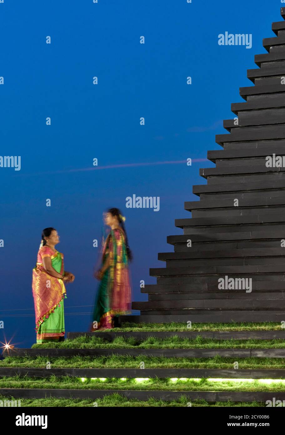 Figures on steps at dusk. Balaji Temple, Andhra Pradesh, India ...