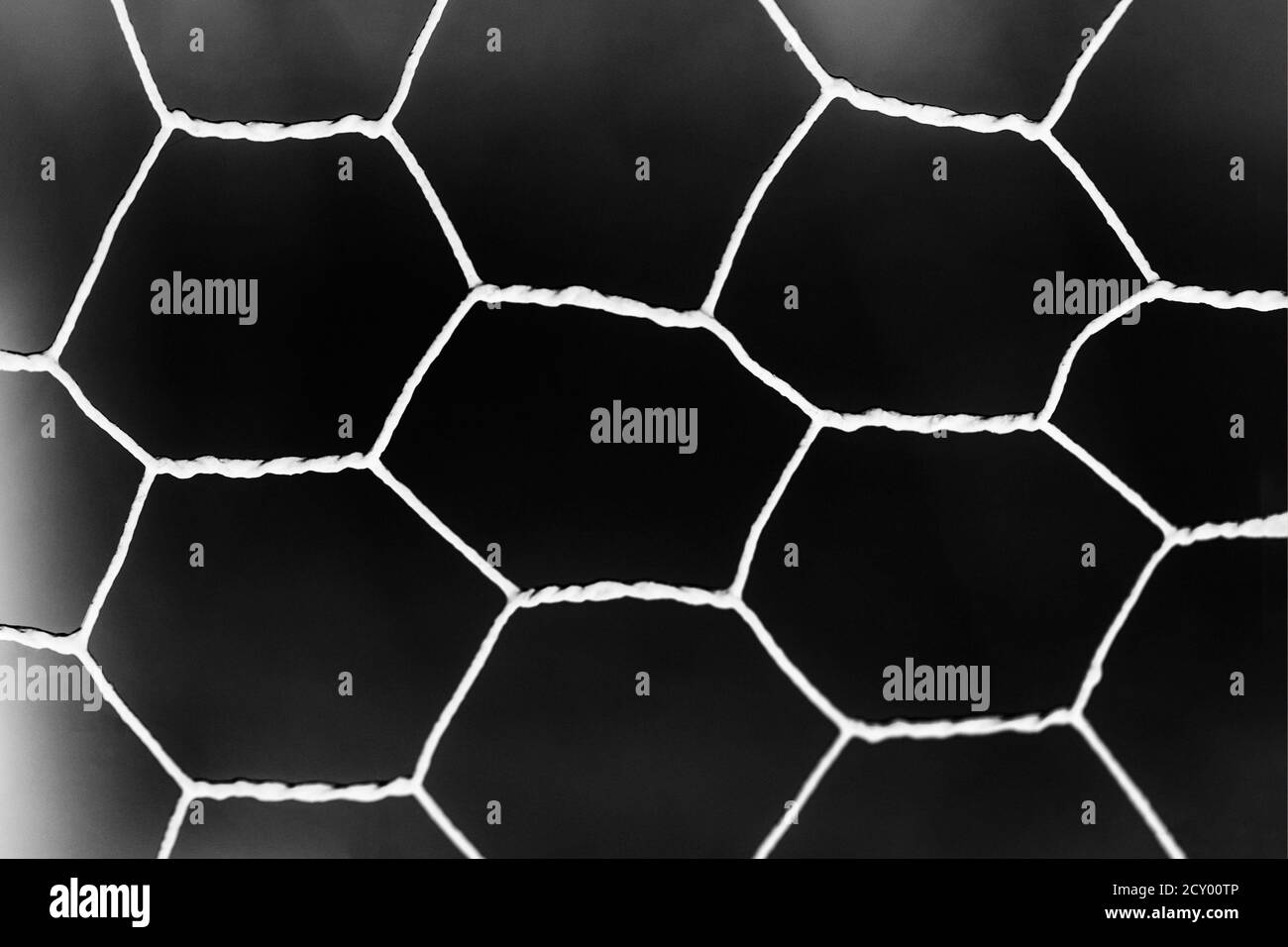 White steel fence, mesh pattern on the black background Stock Photo - Alamy