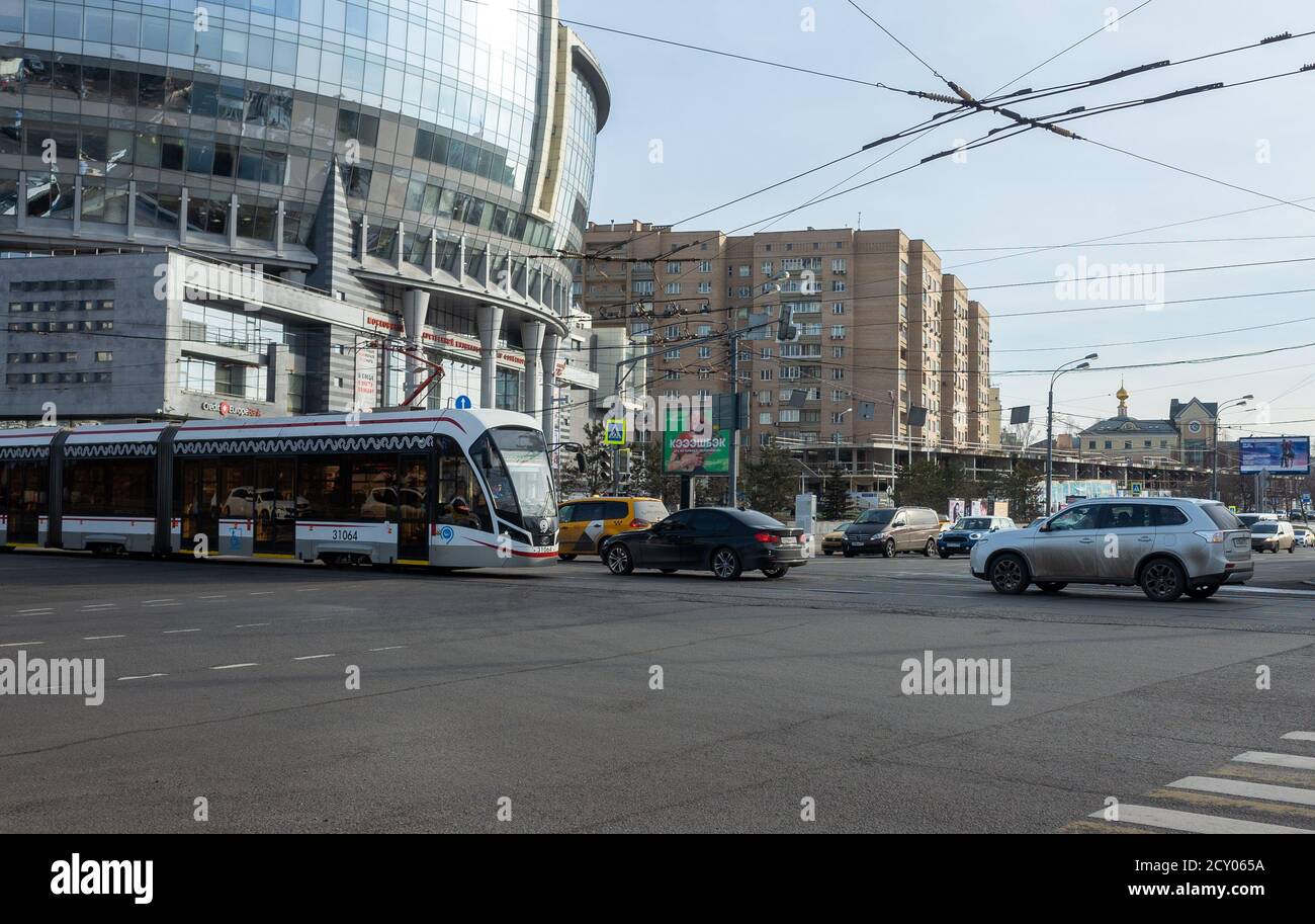 March 18, 2019, Moscow, Russia. A tram on a busy street during rush ...