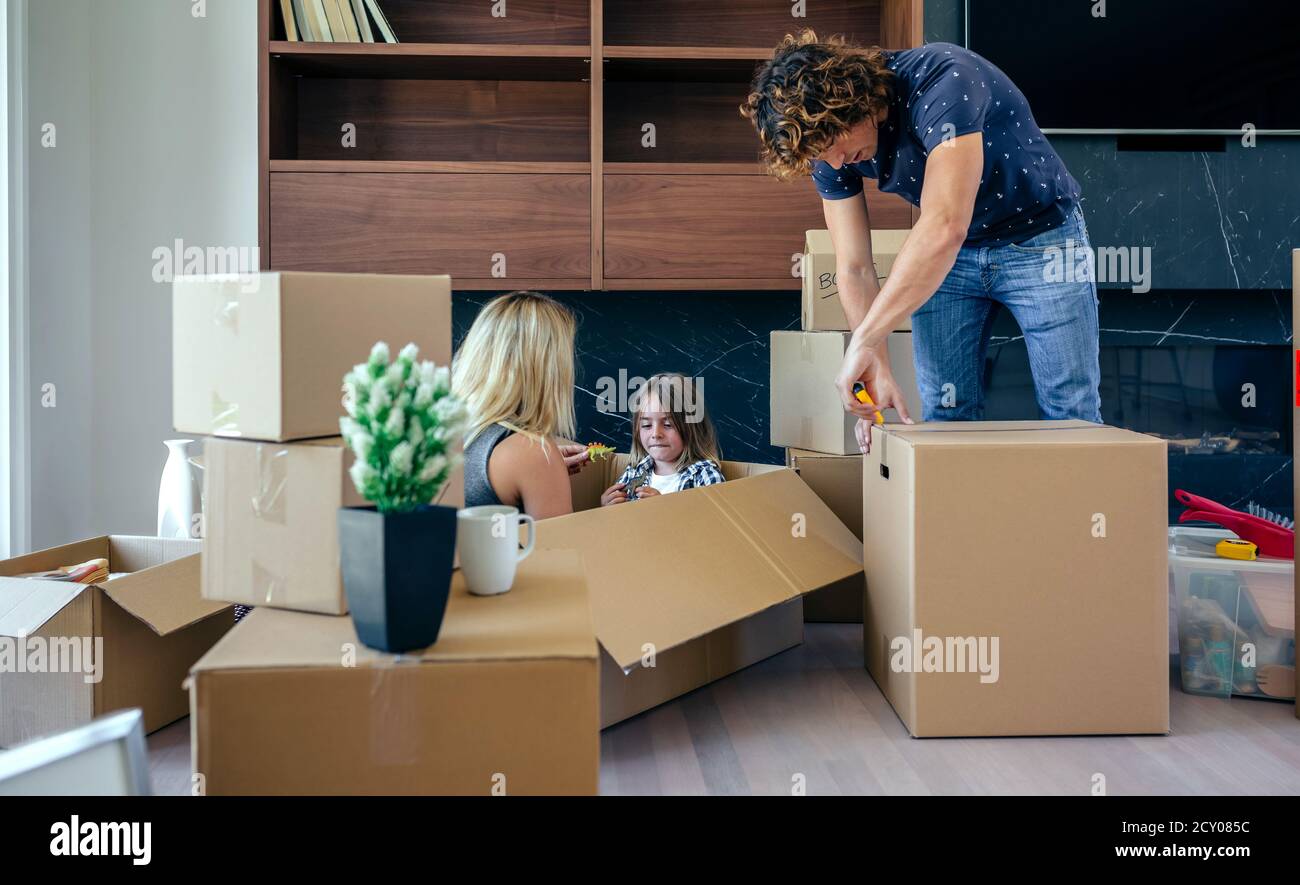 Woman unpacks cardboard box hi-res stock photography and images - Alamy