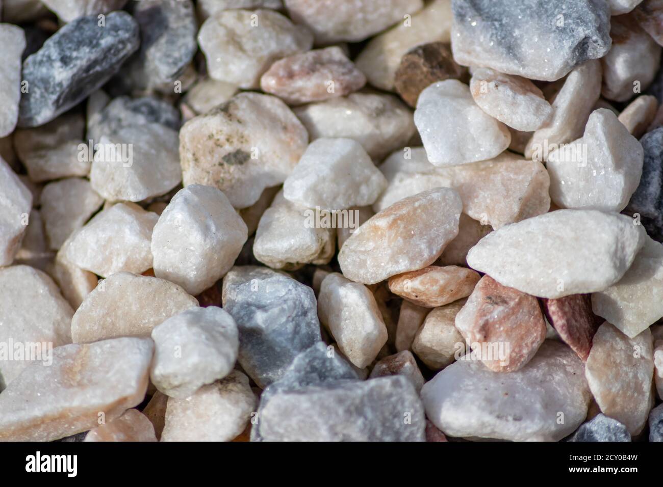 Raw rocks and minerals as natural stones background with crushed and ...