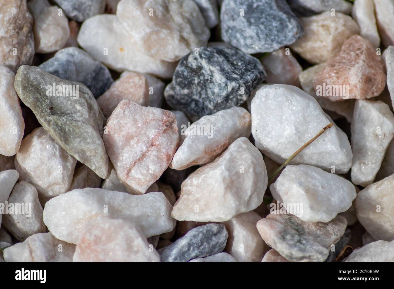 Raw rocks and minerals as natural stones background with crushed and ...
