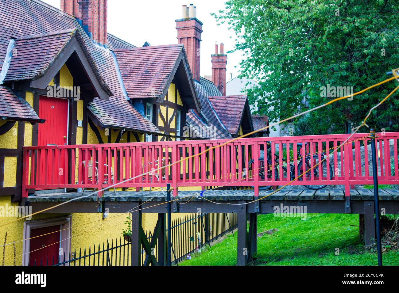 Detail of red railings and sloping facade Stock Photo - Alamy