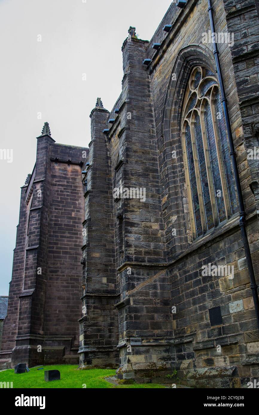 Buttress detail on black stone church facade Stock Photo - Alamy