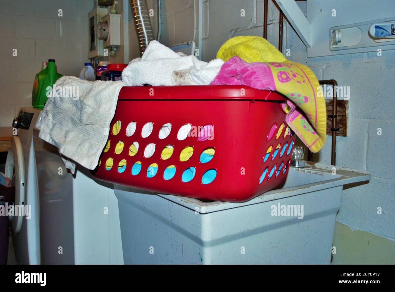 Overflowing laundry basket hi-res stock photography and images - Alamy