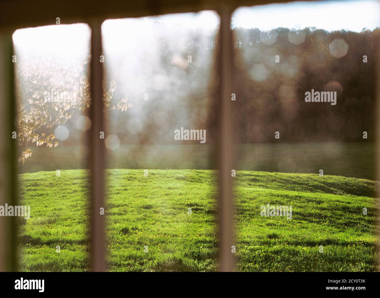 Fall sunlight on a field through a farmhouse window Stock Photo - Alamy