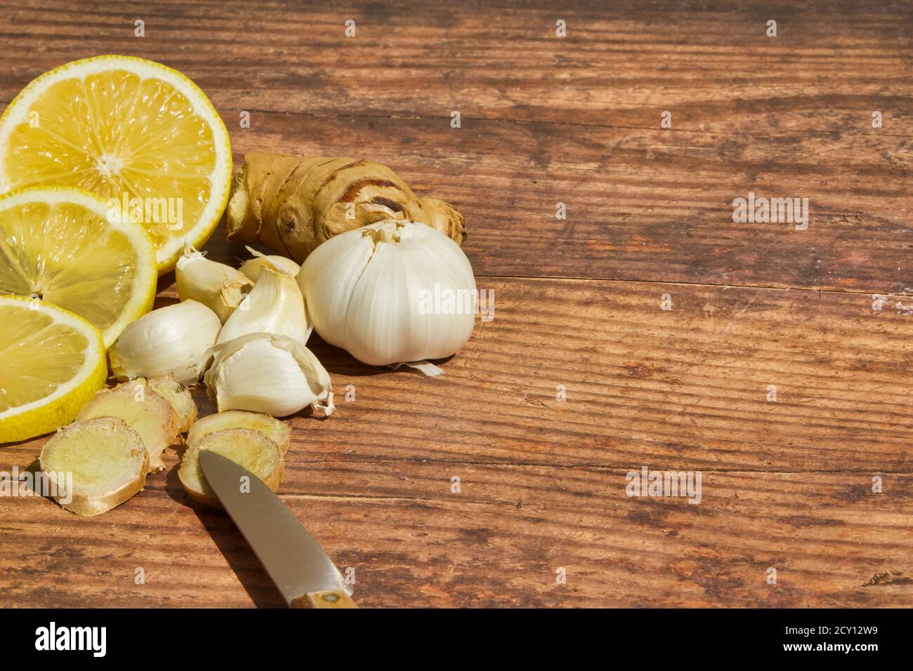 Top view of healthy natural treatments for cold and flu. Lemon slices ...