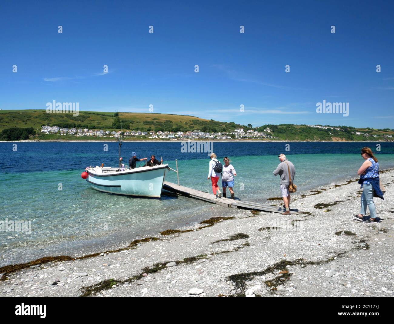 The beach, St Georges or Looe Island, Cornwall. Day trip visitors board ...