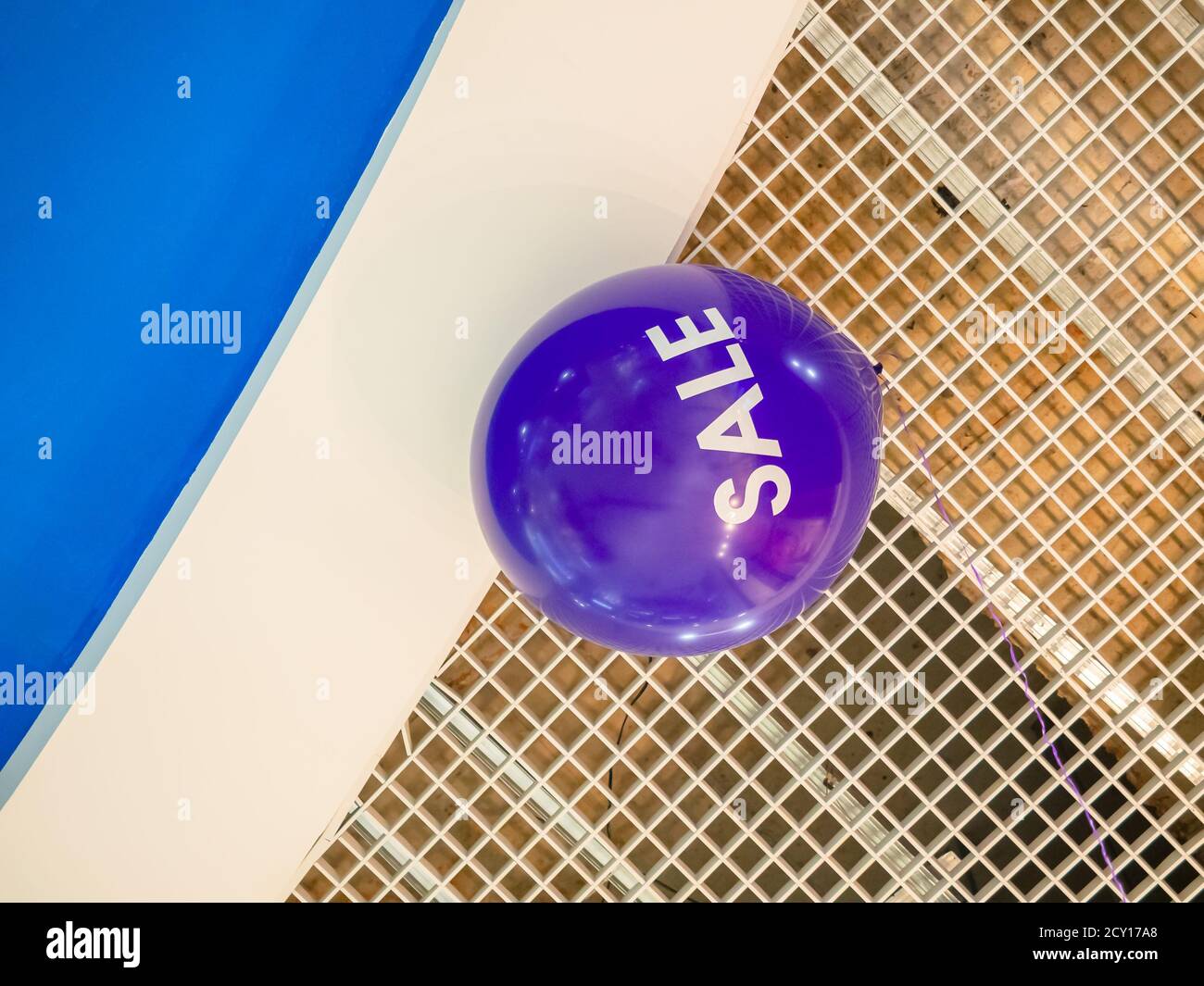 Blue hot air balloon with white lettering sale under the ceiling with ...