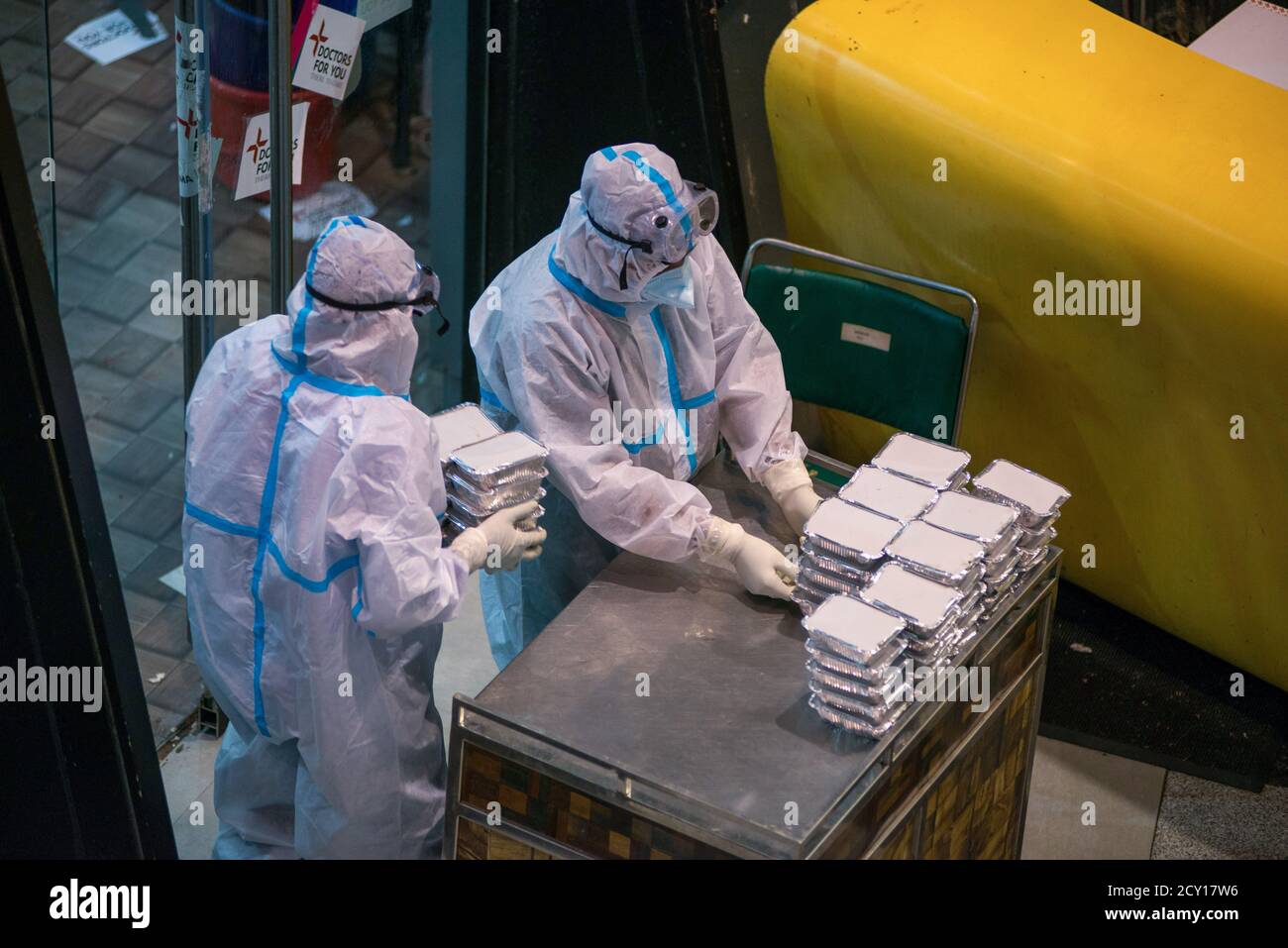 Health workers wearing Personal Protective Equipment (PPE) taking ...