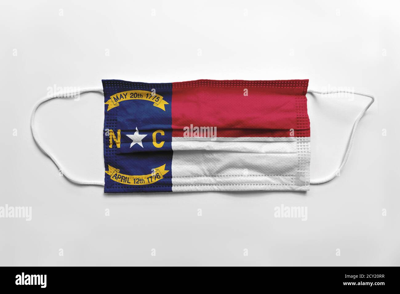 Face mask with North Carolina flag printed, on white background ...