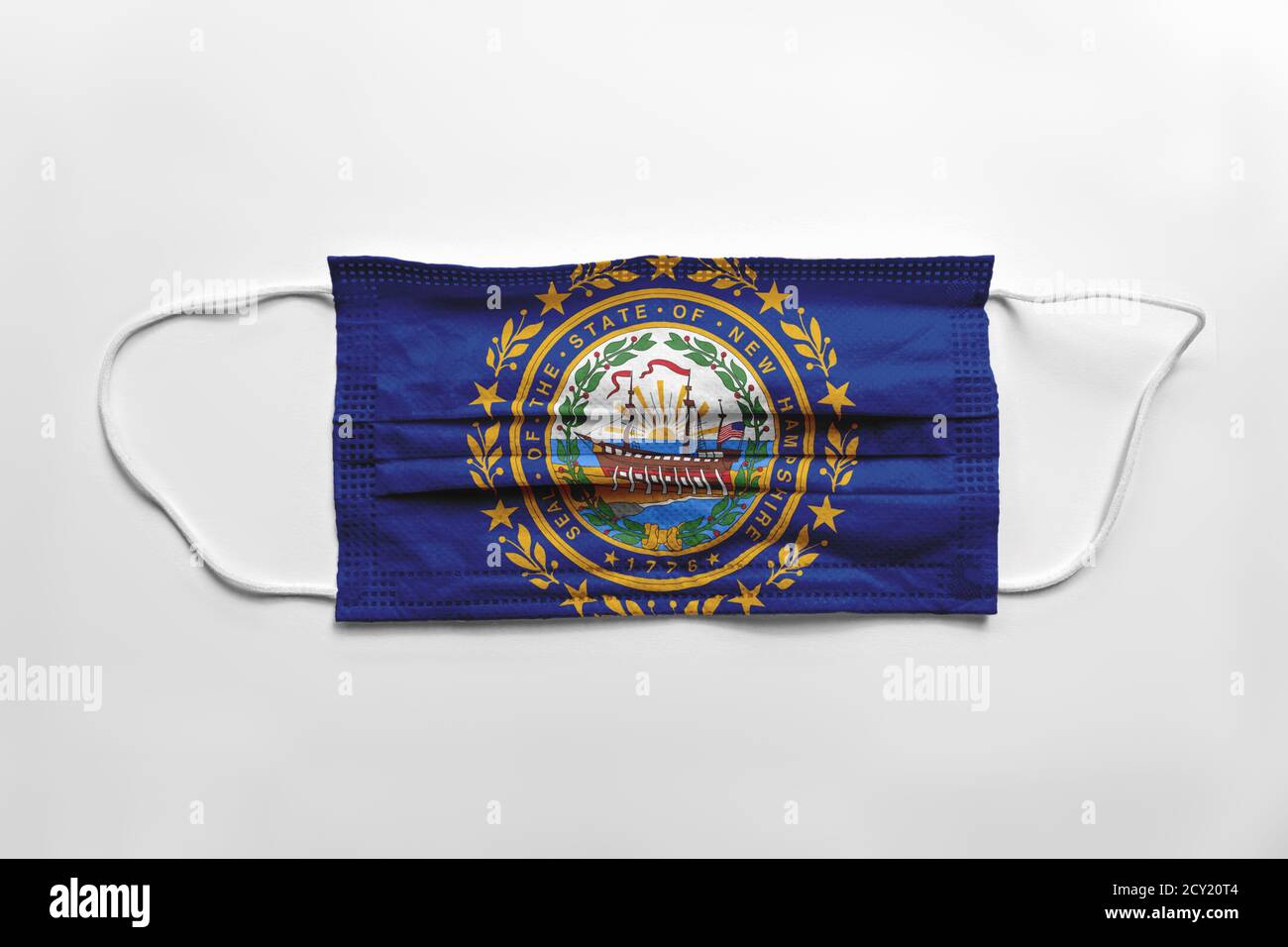 Face mask with New Hampshire flag printed, on white background ...