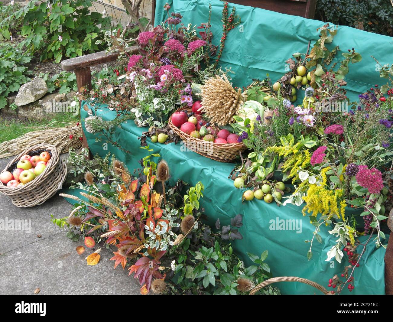 Floral display of fruit, vegetables and flora in an attractive harvest ...