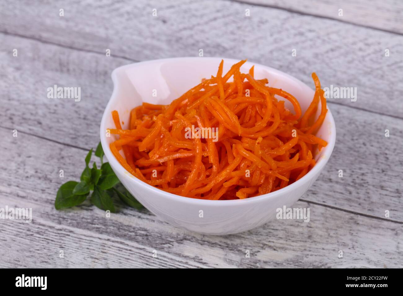 Korean cattot snack salad in the bowl served basil leaves Stock Photo ...