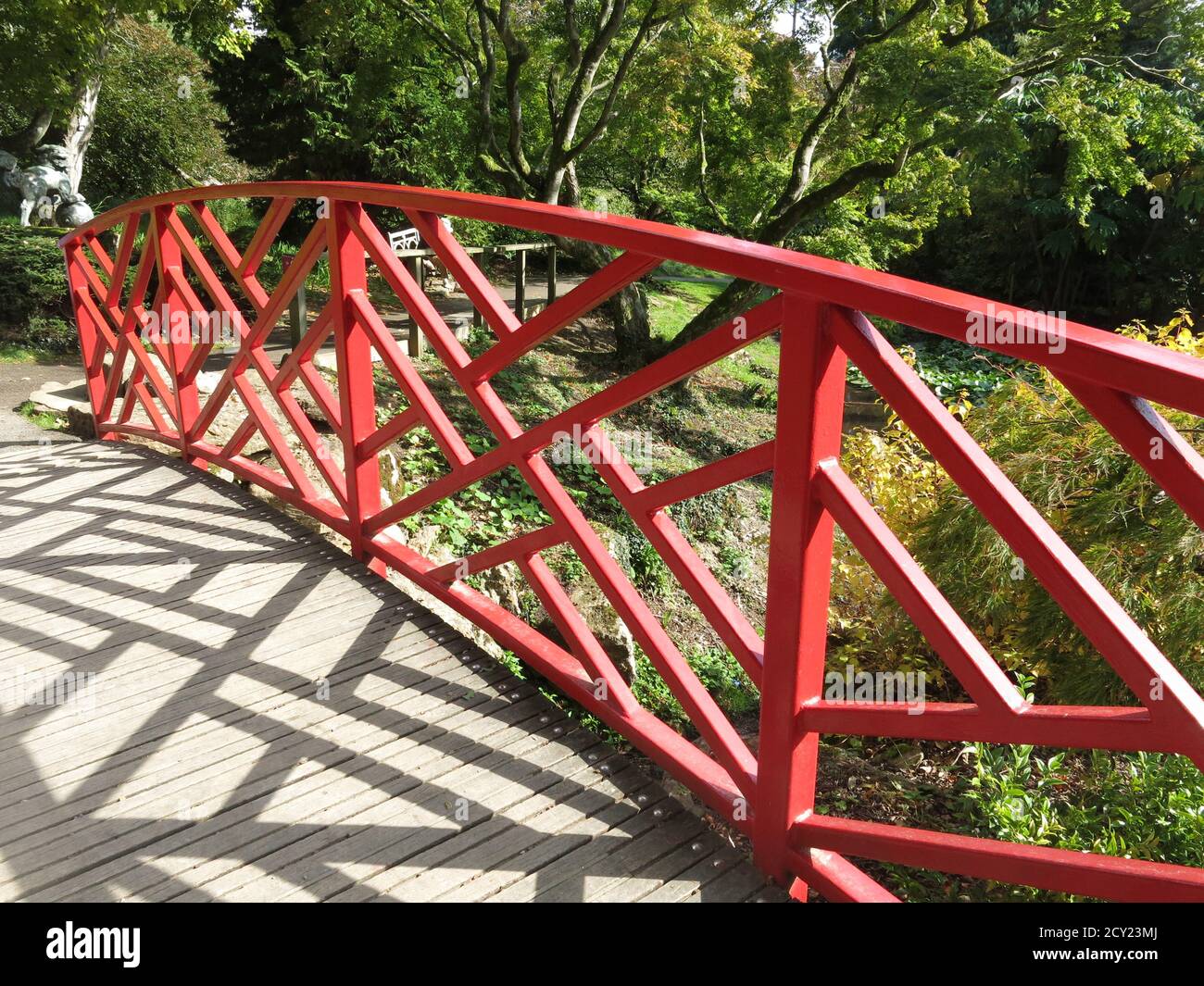 One of the arched, red painted, Japanese-style bridges at Batsford ...