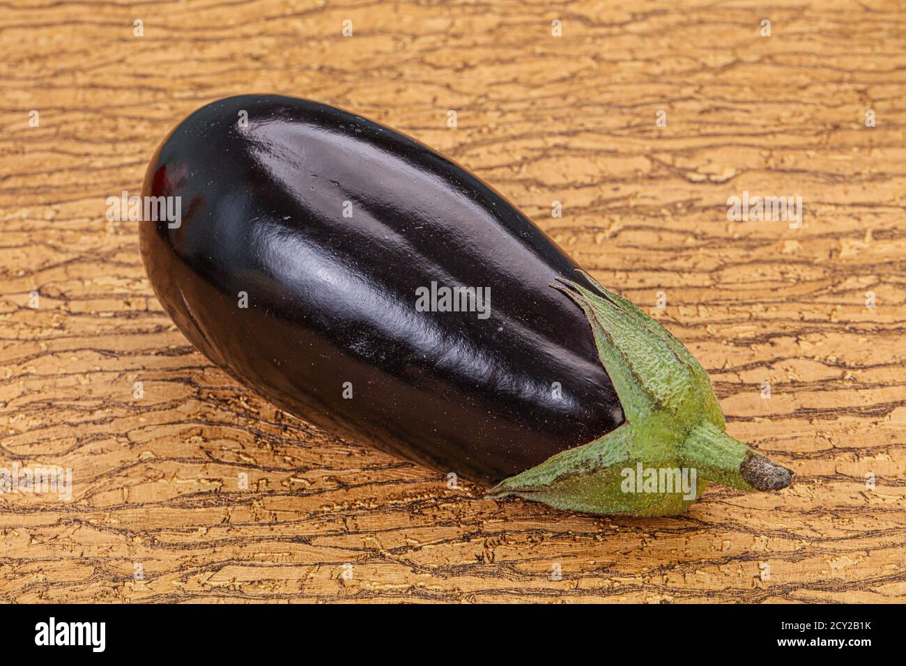 Black ripe fresh one eggplant over background Stock Photo - Alamy