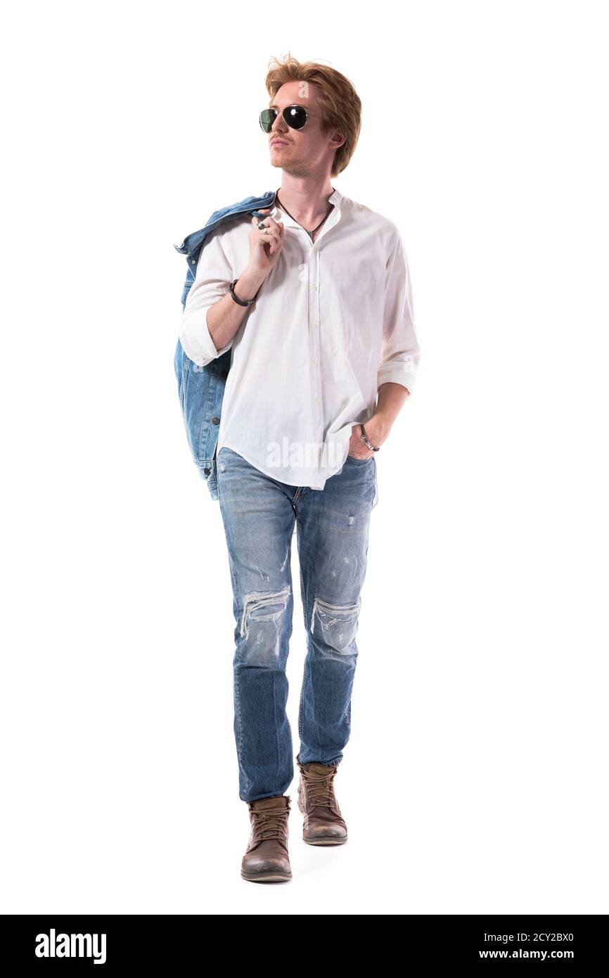 Cool confident handsome stylish young man walking and looking up. Full ...