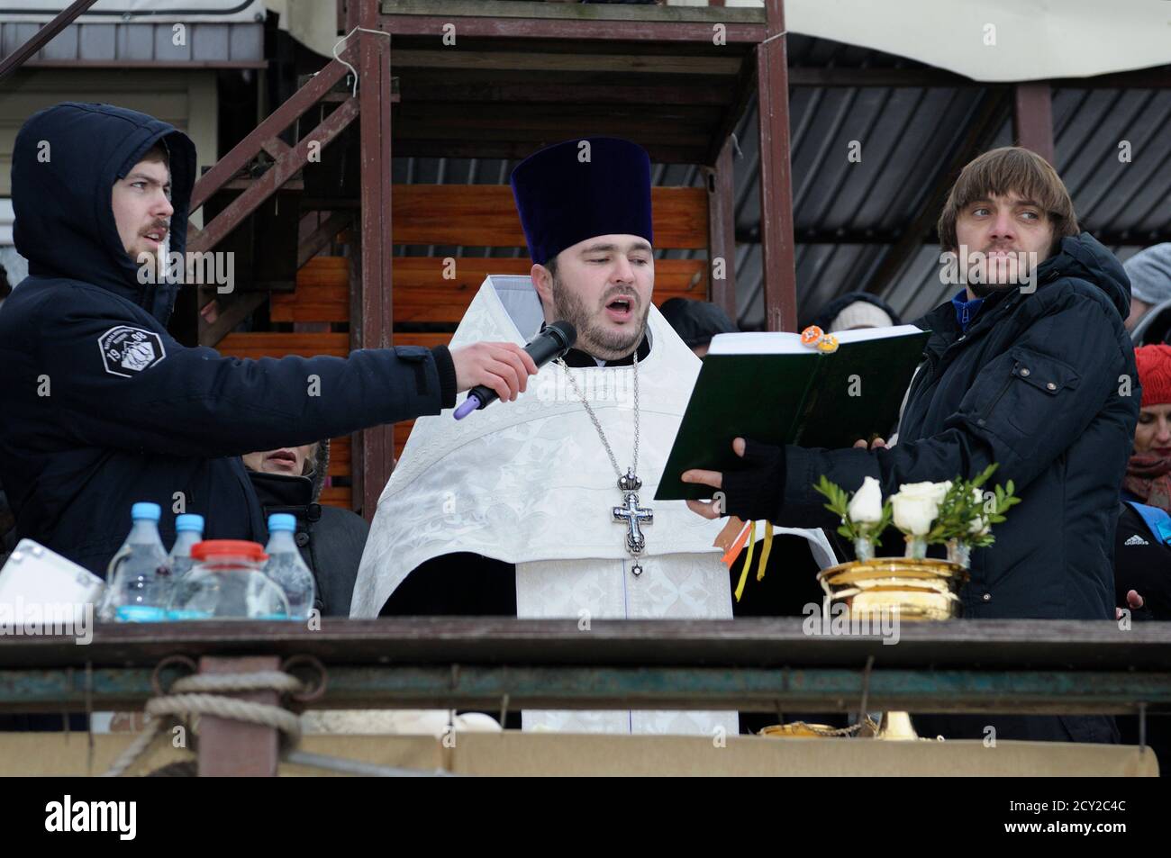 Ukrainian Orthodox Church priest reading Holy Bible during Epiphany on ...