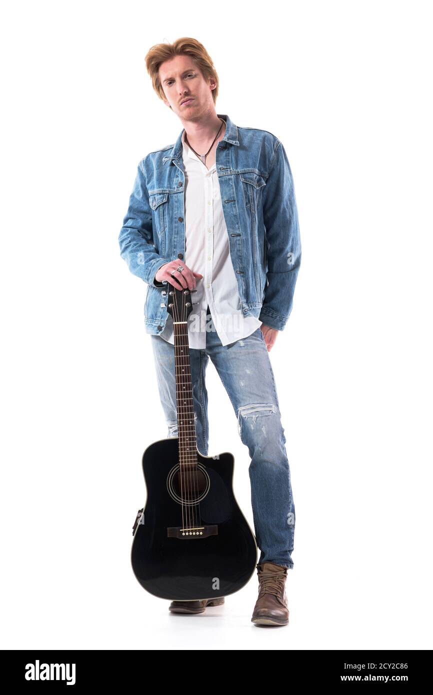 Stylish young man musician looking confident at camera holding acoustic ...
