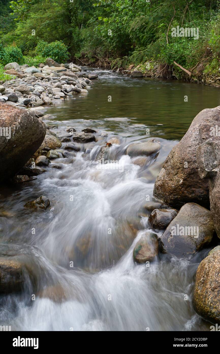 Rushing mountain stream over rocks in Summer Stock Photo - Alamy