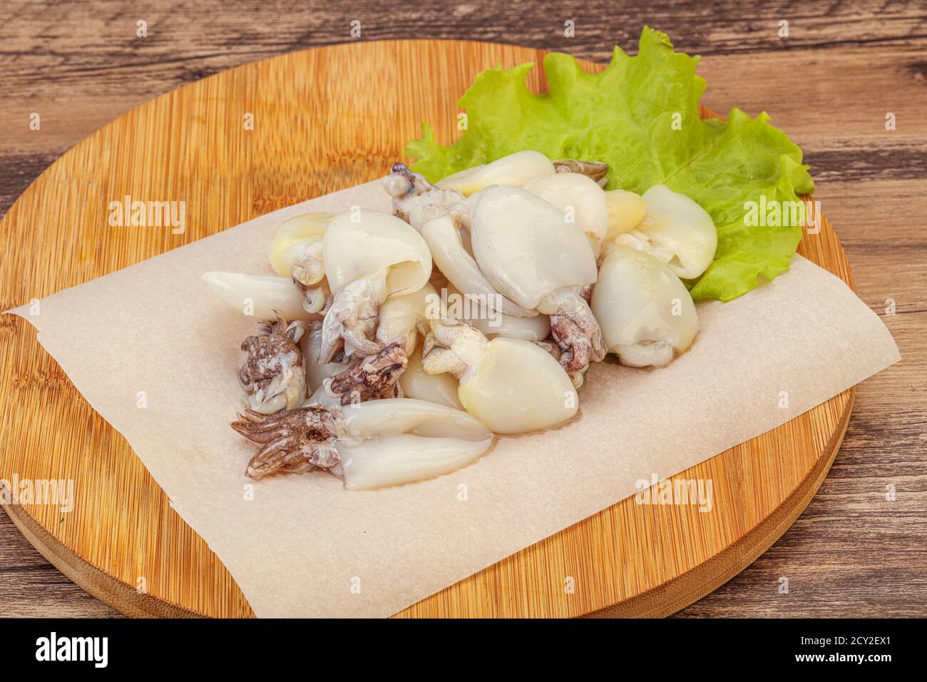 Raw seafood - cuttlefish for cooking over board Stock Photo - Alamy