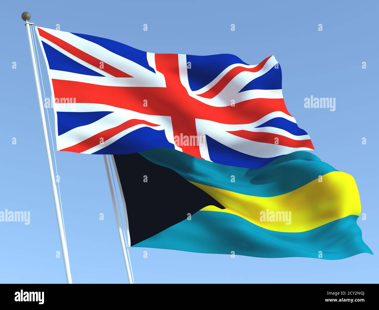 Two waving state flags of United Kingdom and Bahamas on the blue sky ...