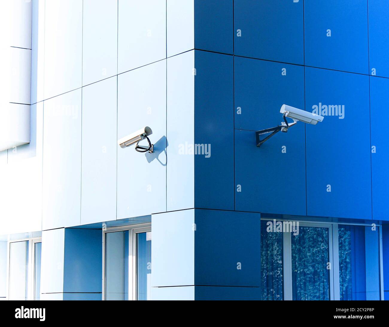 Two surveillance cameras on the building are deployed in opposite ...